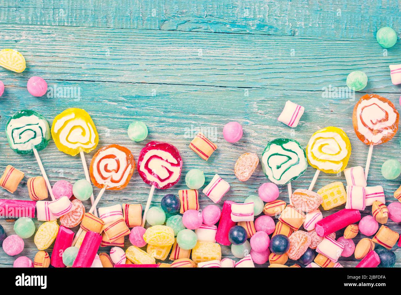 Pastel colored sweets isolated on white background Stock Photo - Alamy