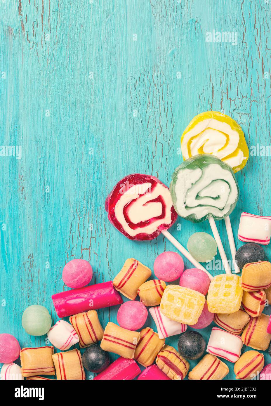 Pastel colored sweets isolated on white background Stock Photo - Alamy