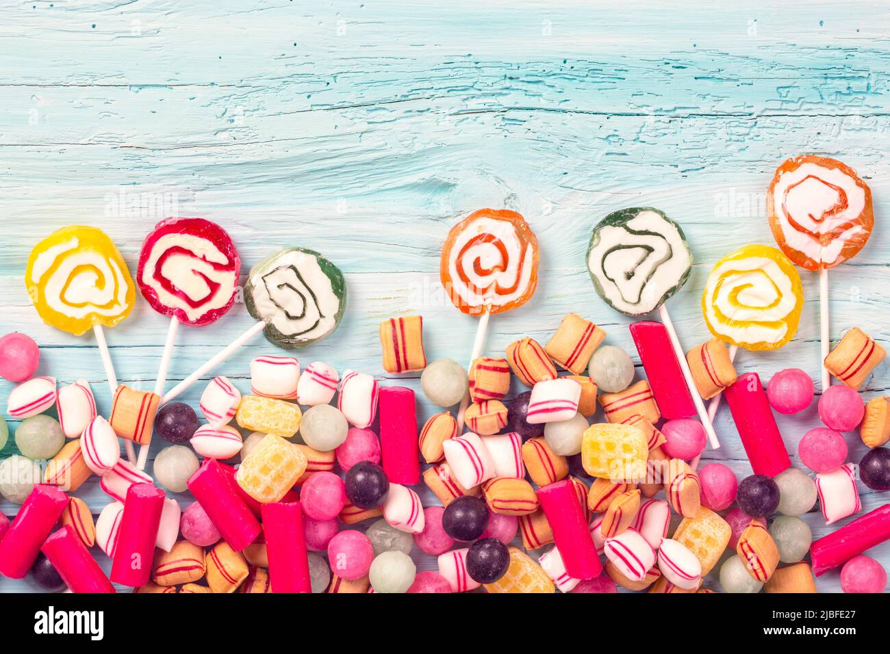 Pastel colored sweets isolated on white background Stock Photo - Alamy