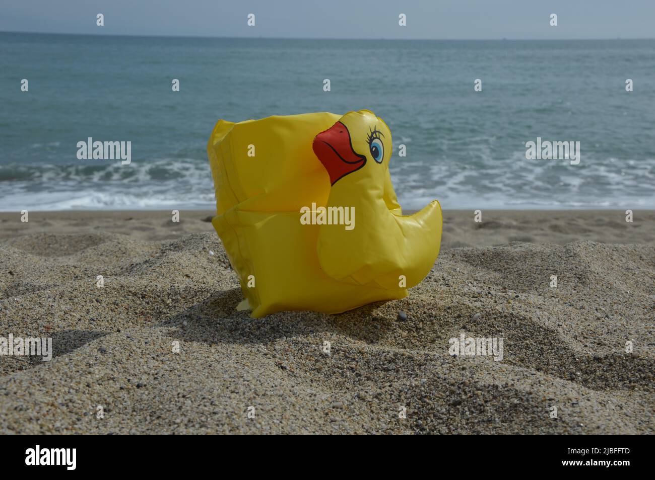 Inflatable duck on the beach Stock Photo - Alamy