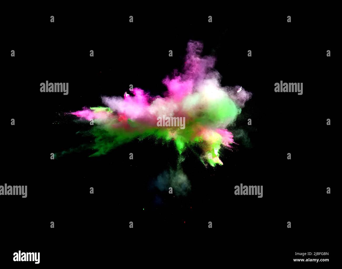 Various multicolored forms of powder paint explode in front of a black ...