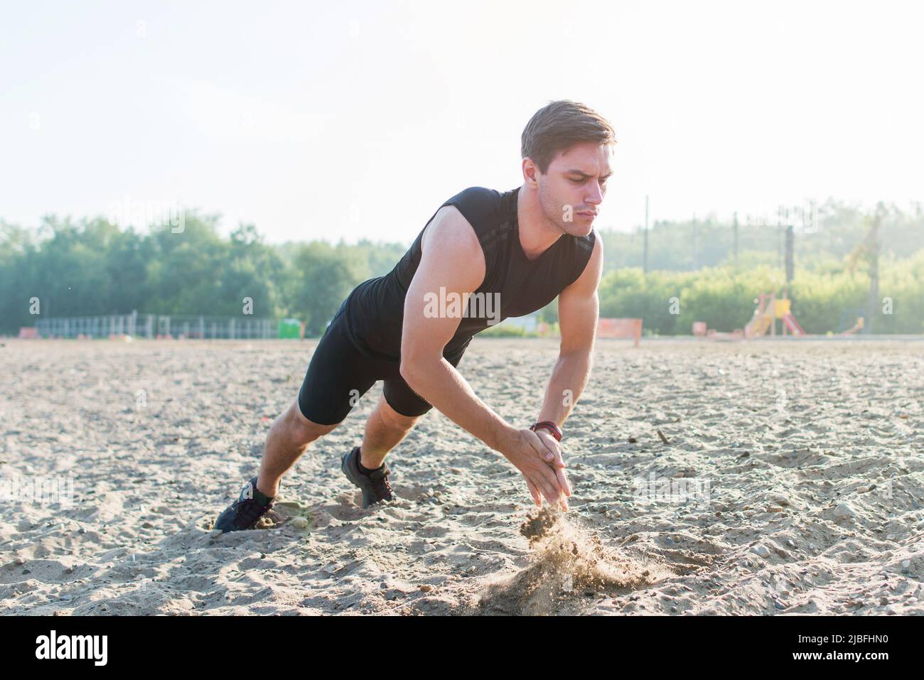 Fit man doing clapping push-ups during training exercise workout on ...