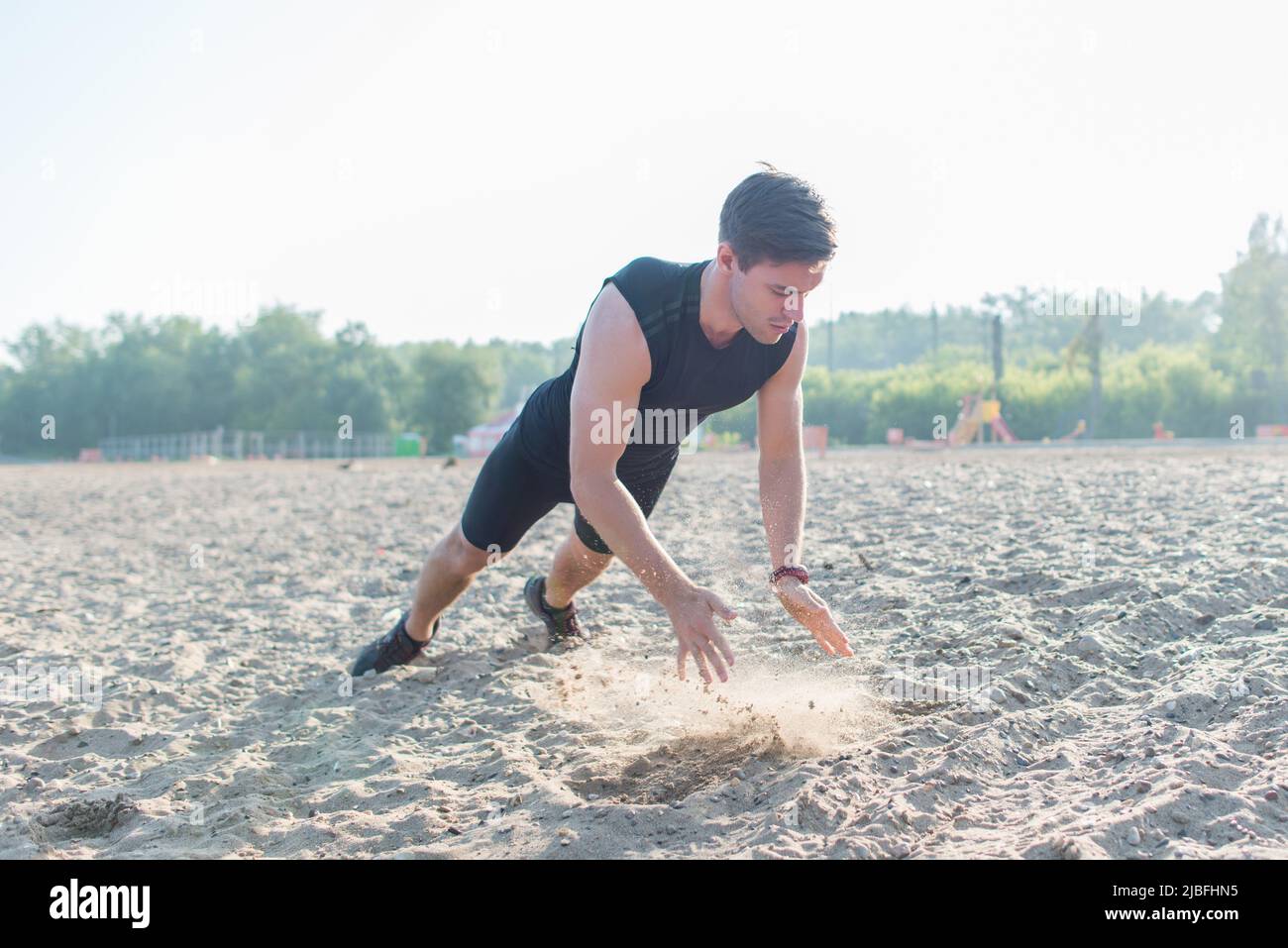 Fit man doing clapping push-ups during training exercise workout on ...