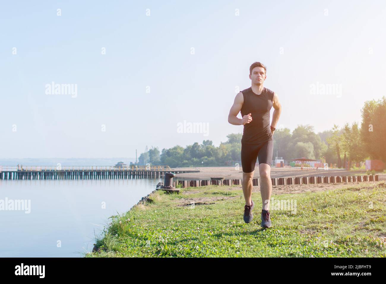 Man running in beach morning hi-res stock photography and images - Alamy
