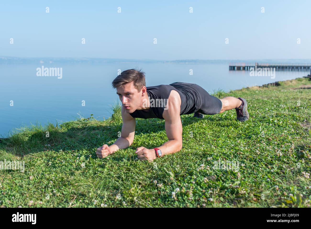 Fitness Man Working Out His Midsection Core Muscles Doing Plank