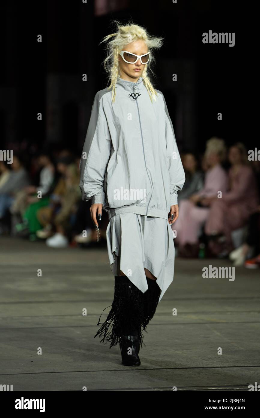 A model walks the runway in a design by PHOEBE PENDERGAST during the ...