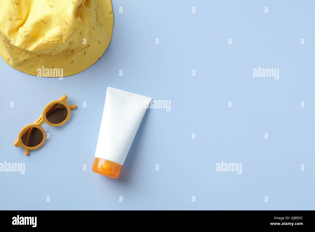 Baby sunscreen cream design, branding. Plastic tube with orange cap ...
