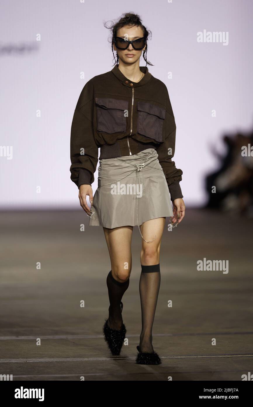 A model walks the runway in a design by PHOEBE PENDERGAST during the ...