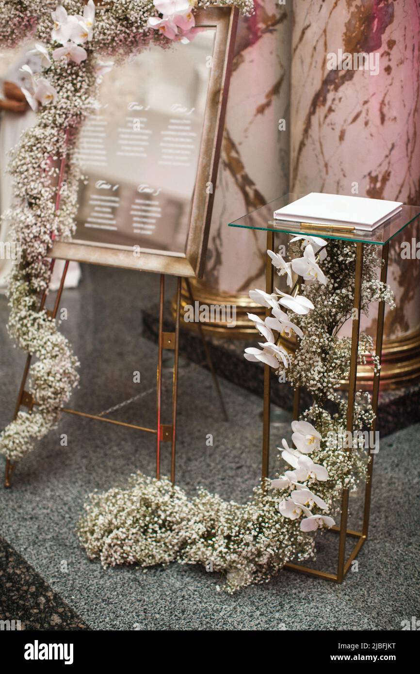 Beautiful elegant stylish wedding guest table list Stock Photo - Alamy