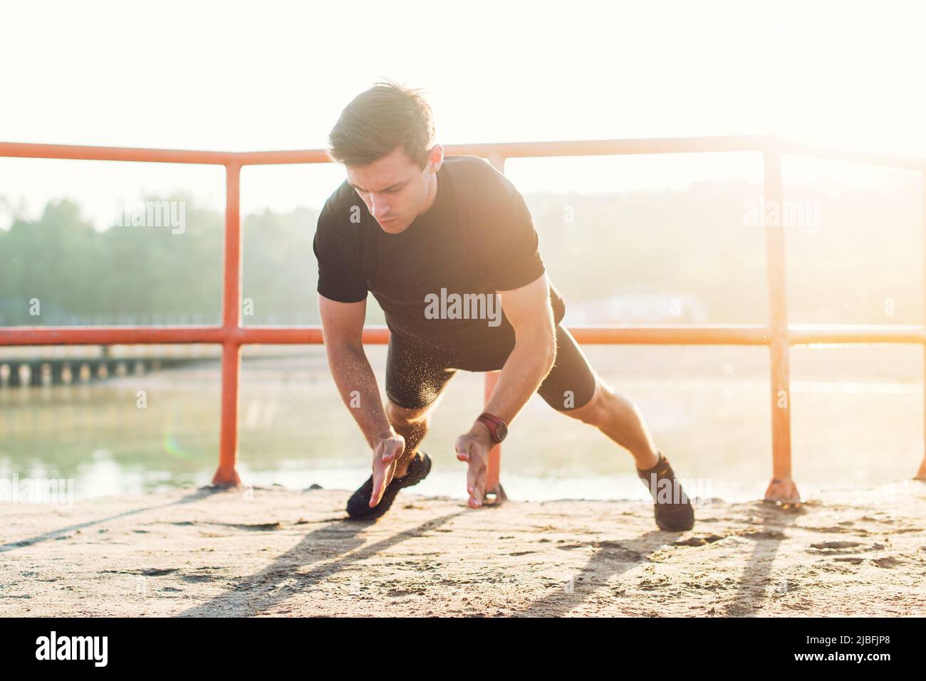 Fitness man doing clapping push-ups exercise intense training outdoors ...
