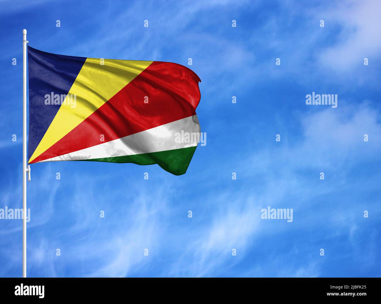National flag of Seychelles on a flagpole Stock Photo - Alamy