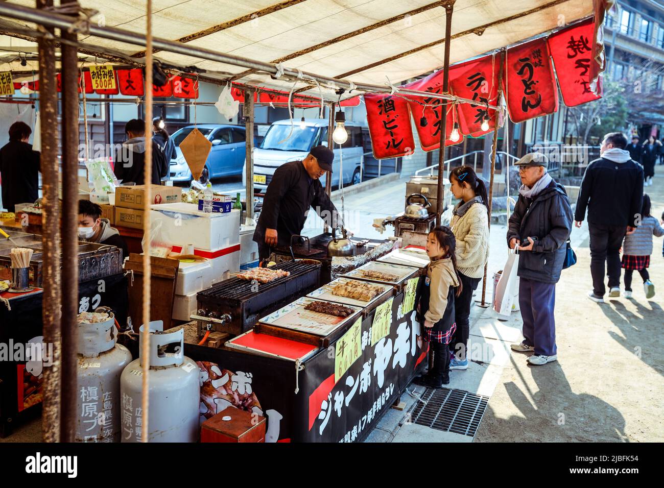 Japanese Man selling Traditional Street food in Itsukushima Island ...