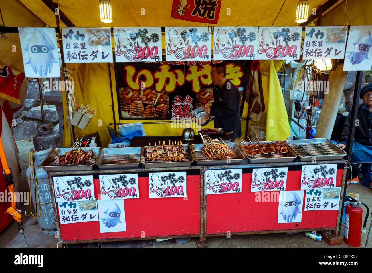 Japanese Man selling Traditional Street food in Itsukushima Island ...