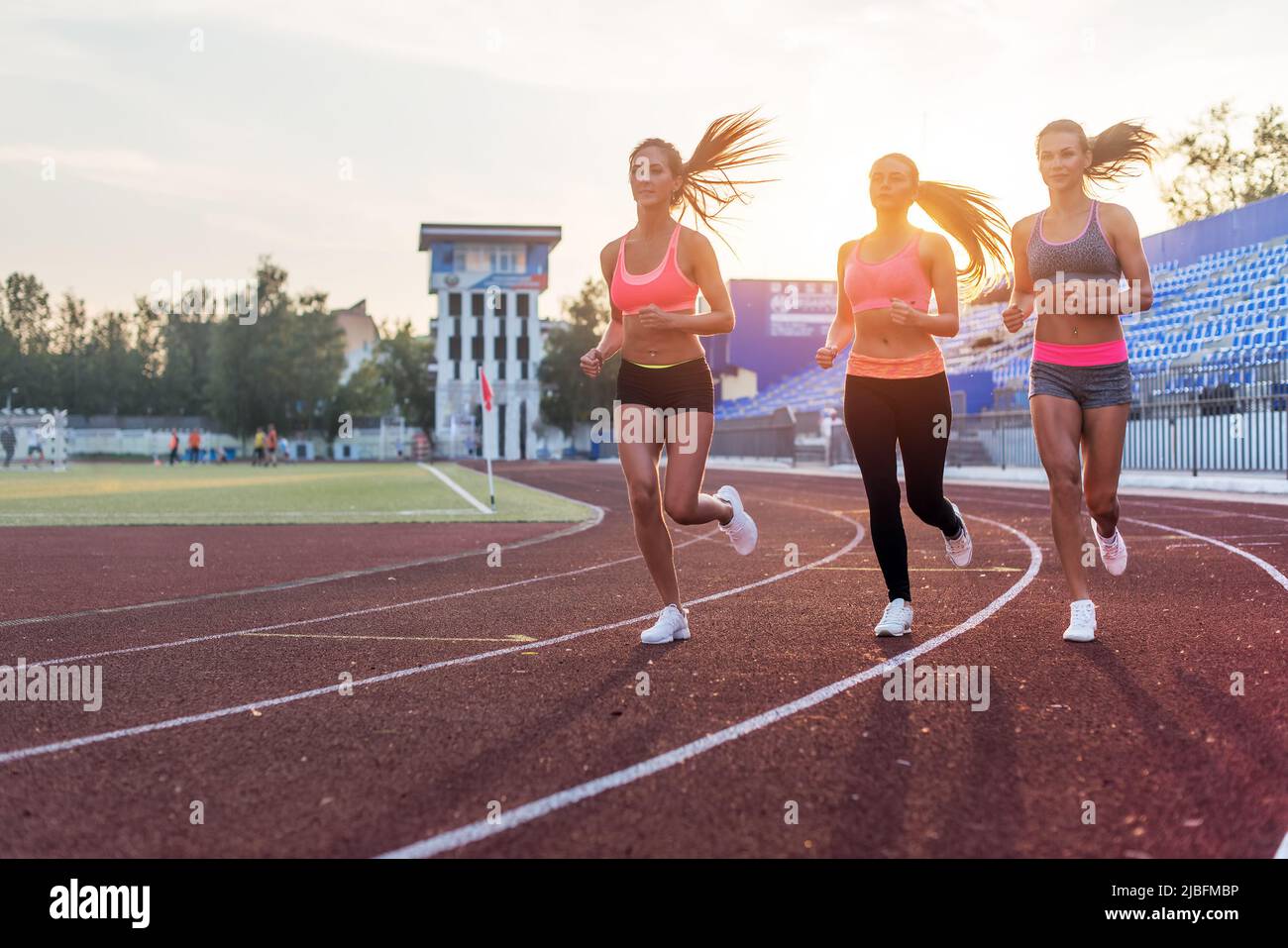 Athletes running in the stadium hi-res stock photography and images - Alamy