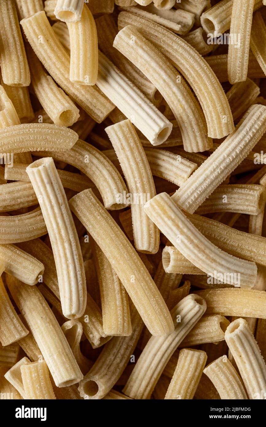 Close-up view of raw sedanini rice pasta Stock Photo - Alamy