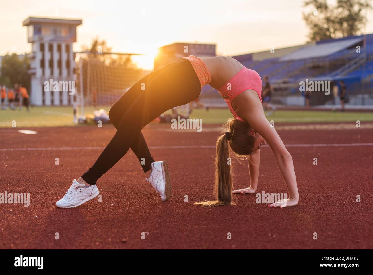 Fit woman doing sport exercise Upward Bow or Wheel Posture Stock Photo ...