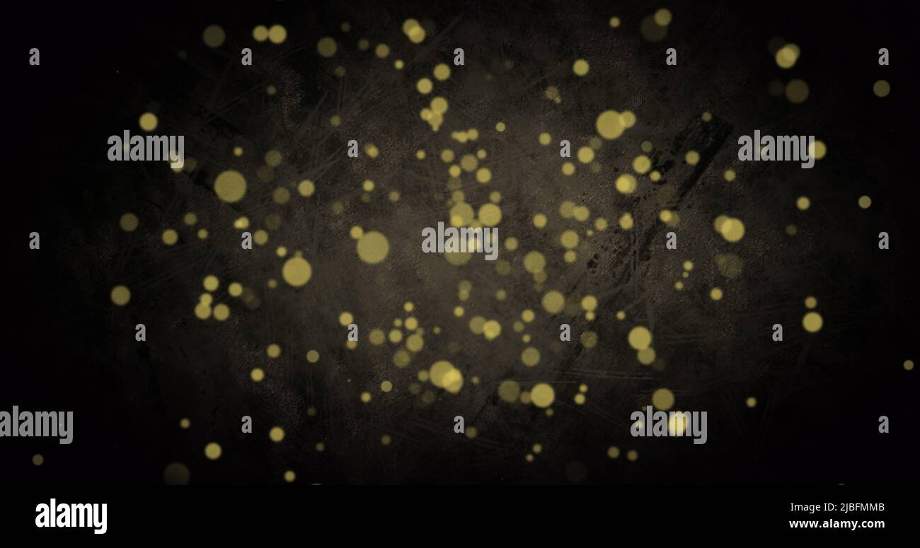 Image of golden dots falling on black background Stock Photo - Alamy
