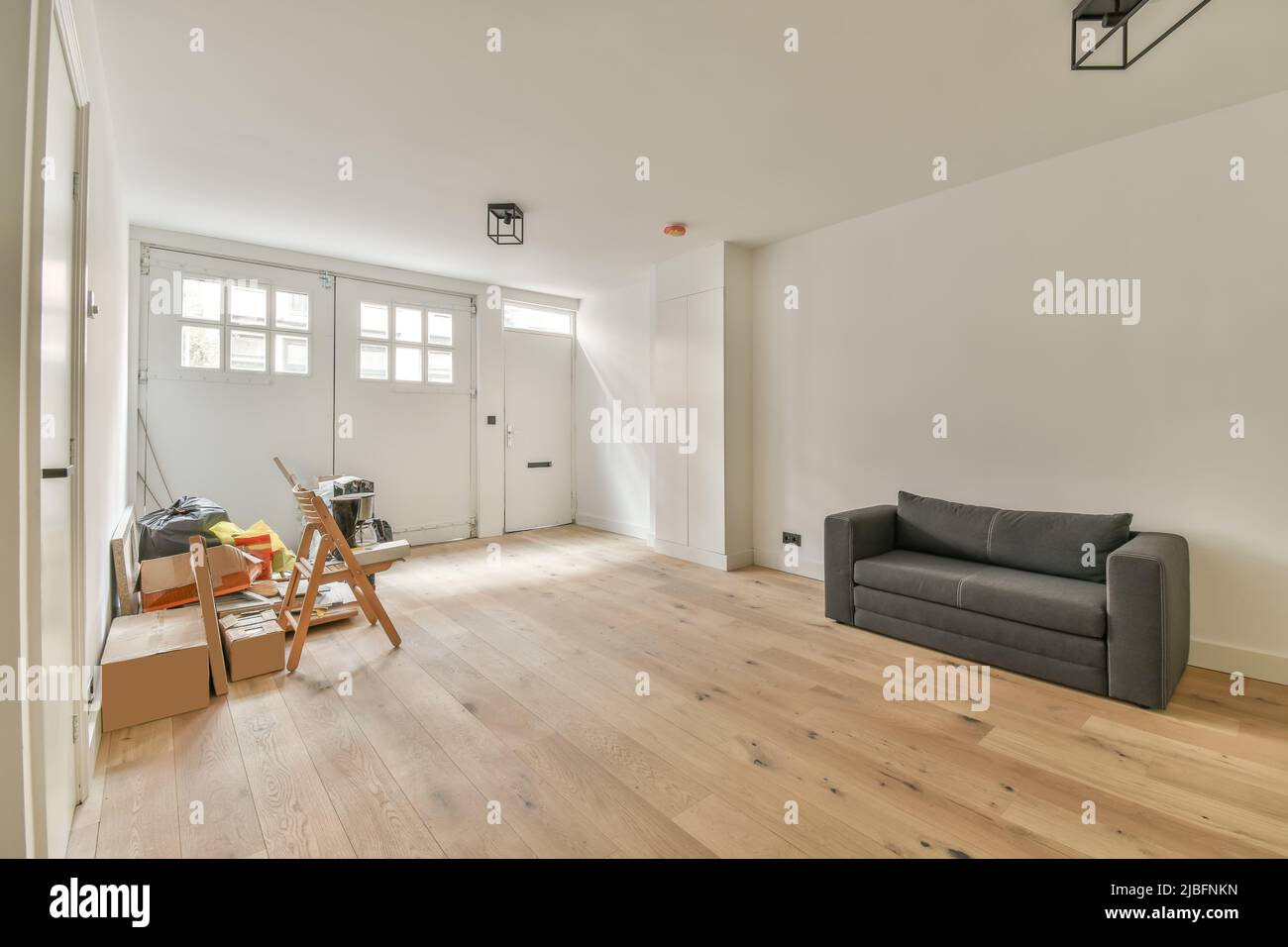 Modern empty open plan living room with couch freshly refurbished ...