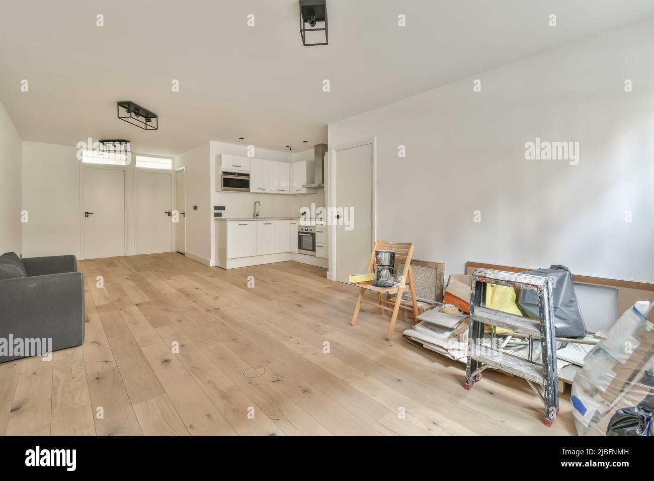 Modern empty open plan living room with couch freshly refurbished ...