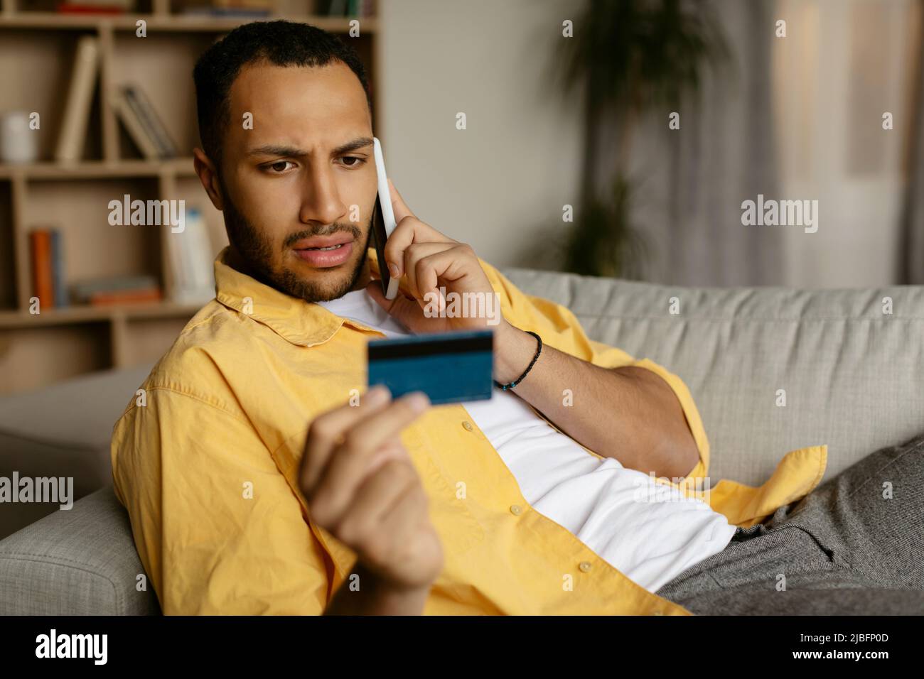 African man having online payment hi-res stock photography and images ...