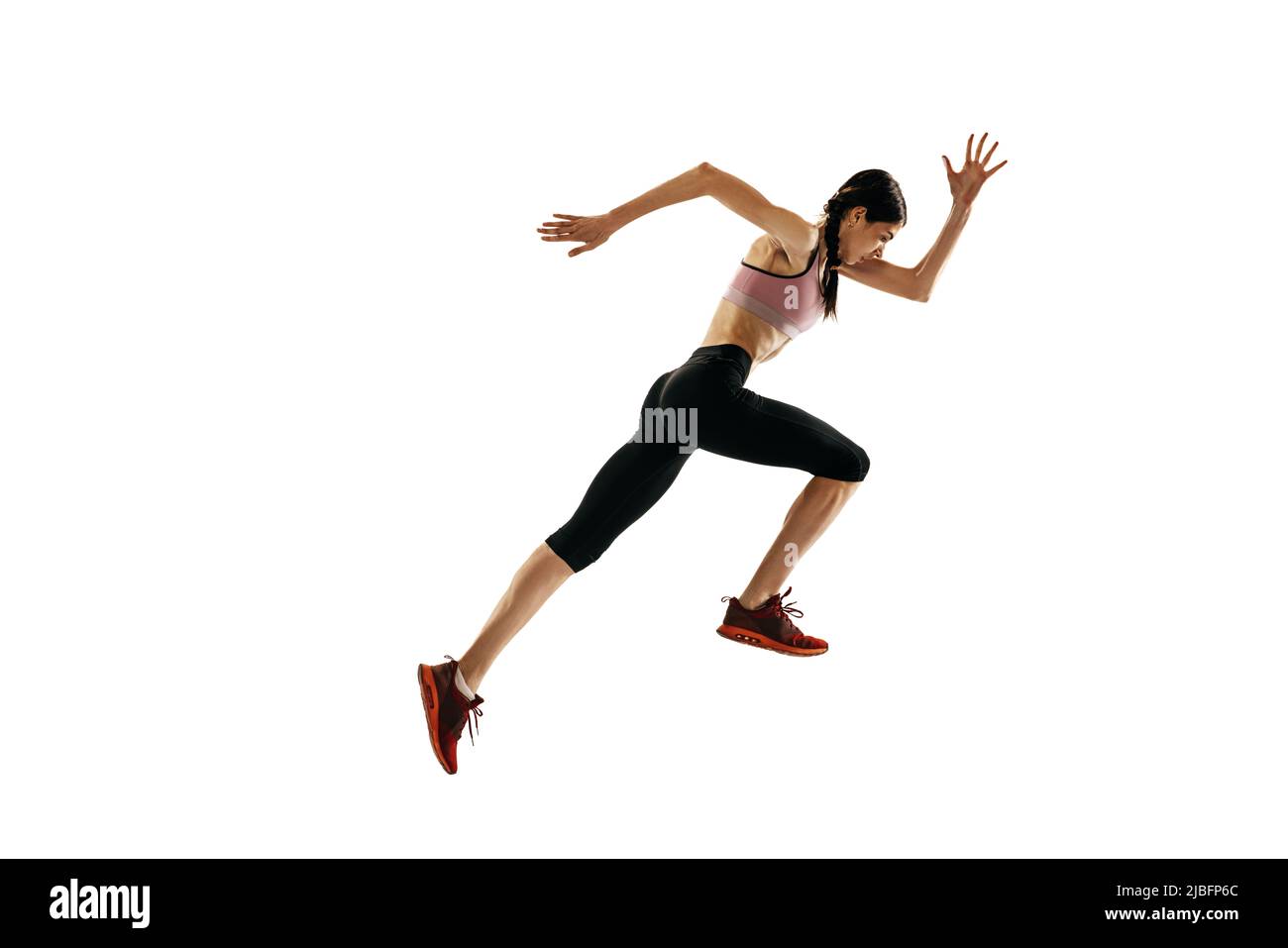 Young caucasian woman running isolated on white studio background. One ...