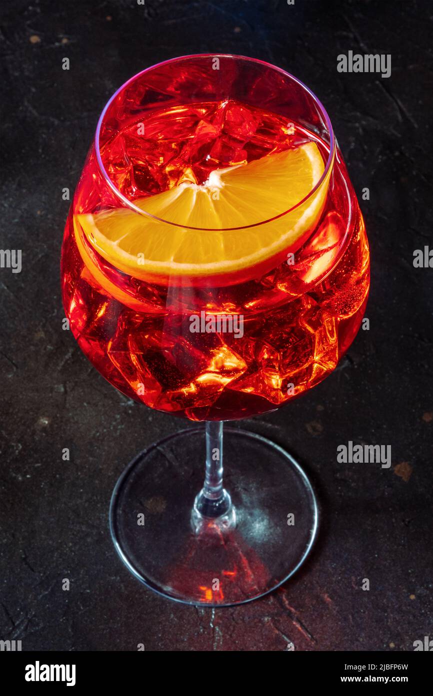 Aperol cocktail glass with an orange slice, Italian summer cold drink ...