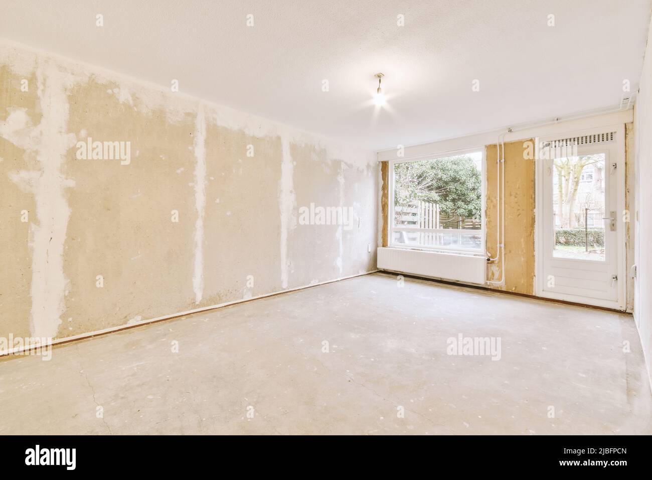 Empty living room in apartment under refurbish work Stock Photo - Alamy