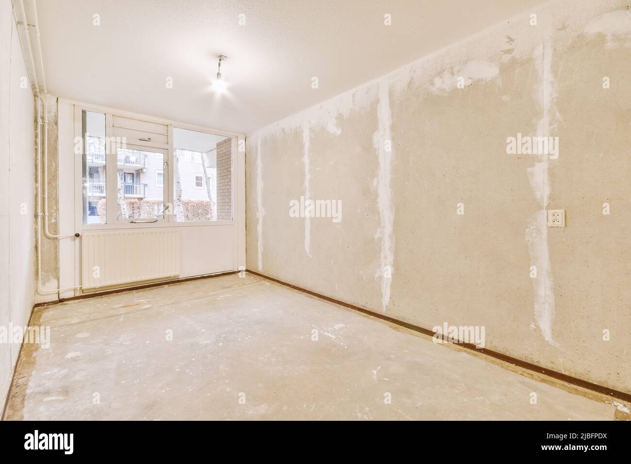 Empty living room in apartment under refurbish work Stock Photo - Alamy