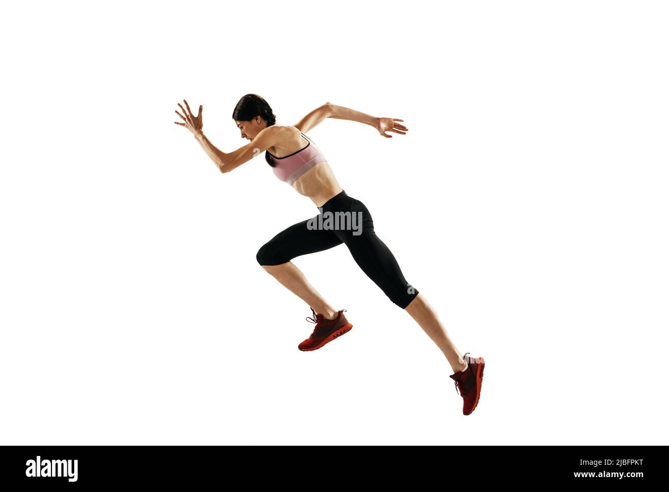 Young caucasian woman running isolated on white studio background. One ...