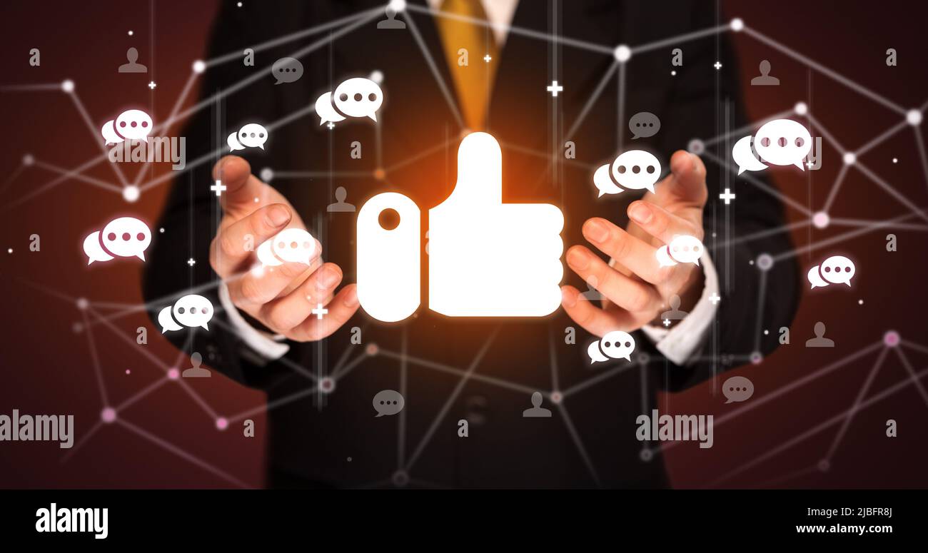 Hand holding social media icons Stock Photo - Alamy