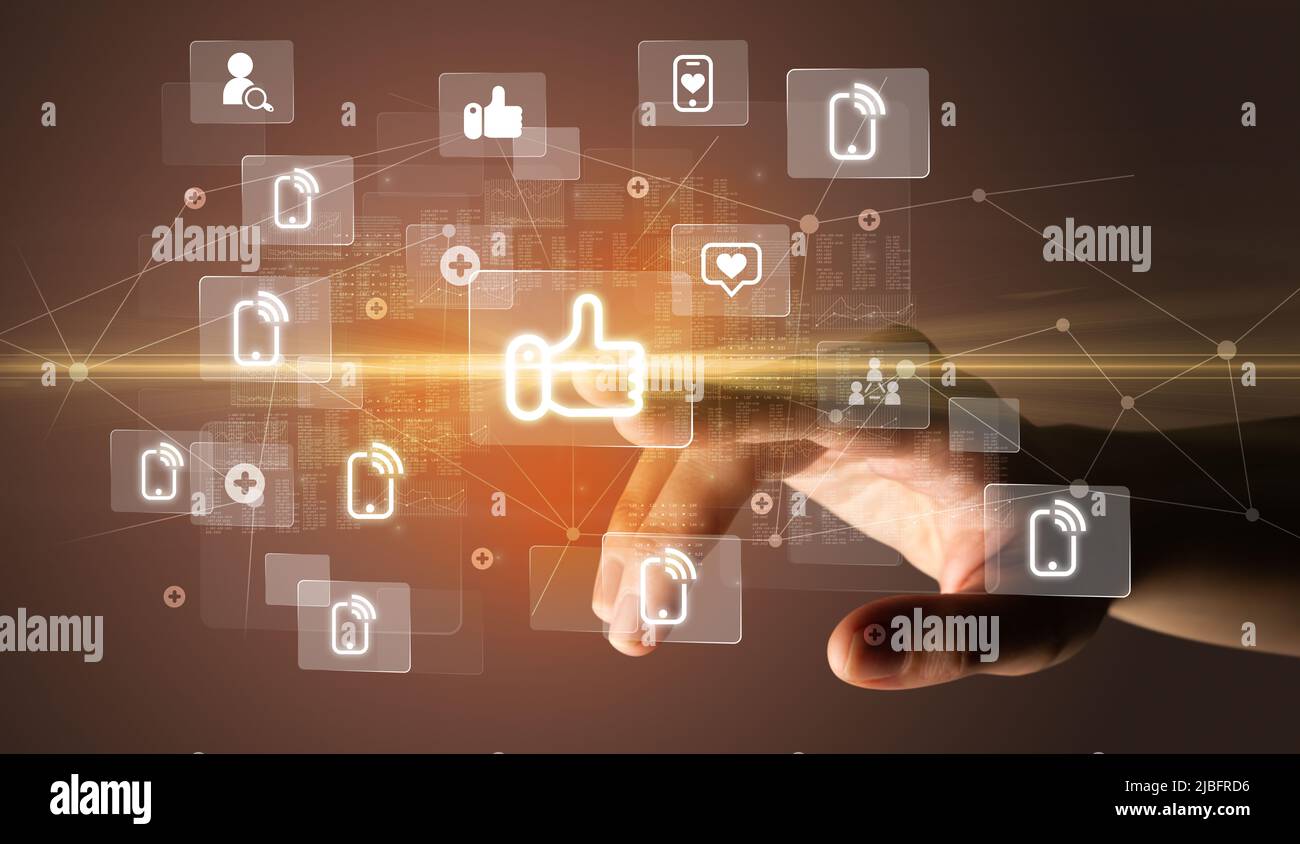Hand pressing social media multimedia application screen with media ...