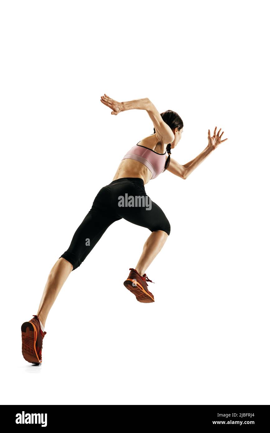Young caucasian woman running isolated on white studio background. One ...
