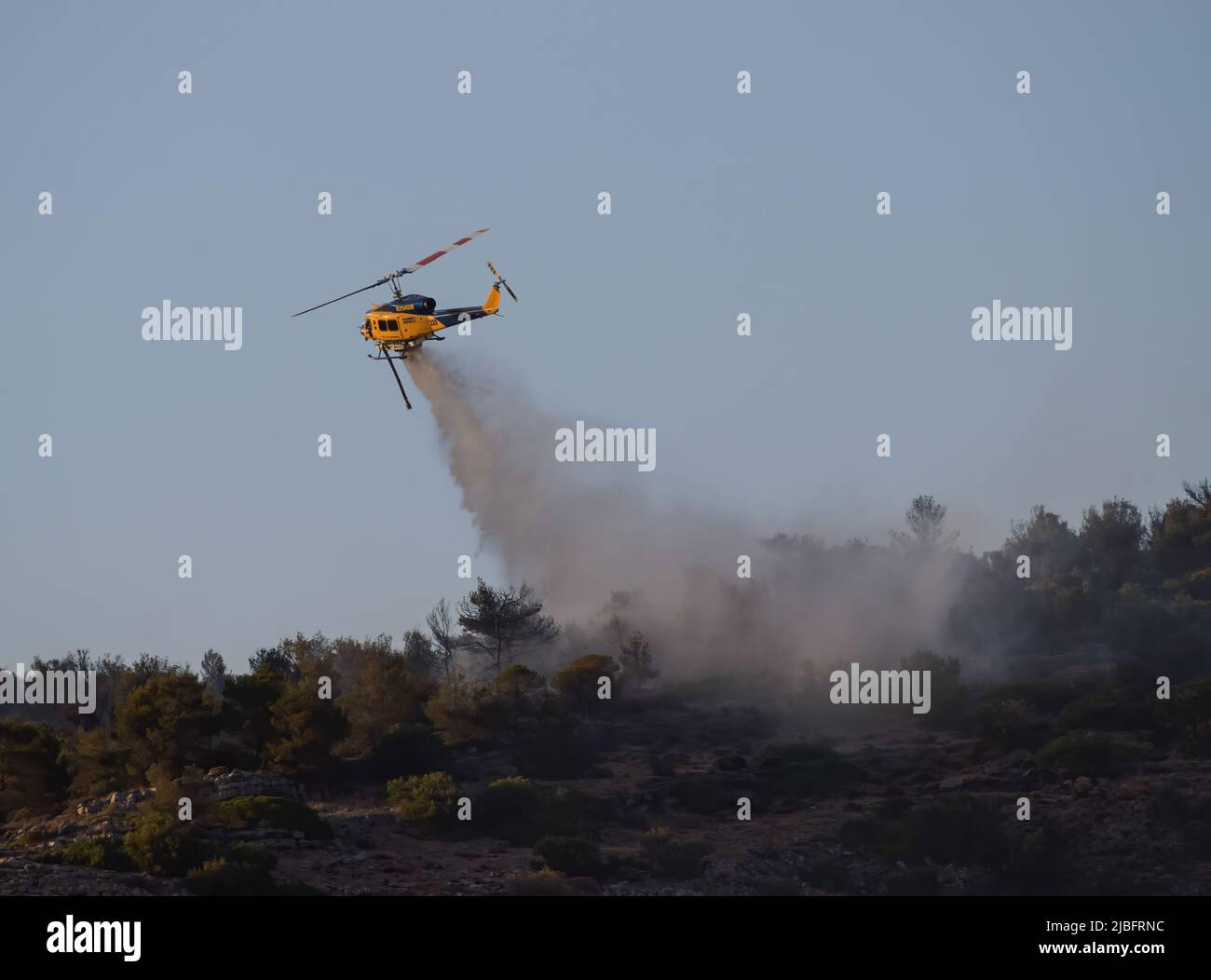 A firefighting McDermott Aviation N254SM helicopter operates in the ...