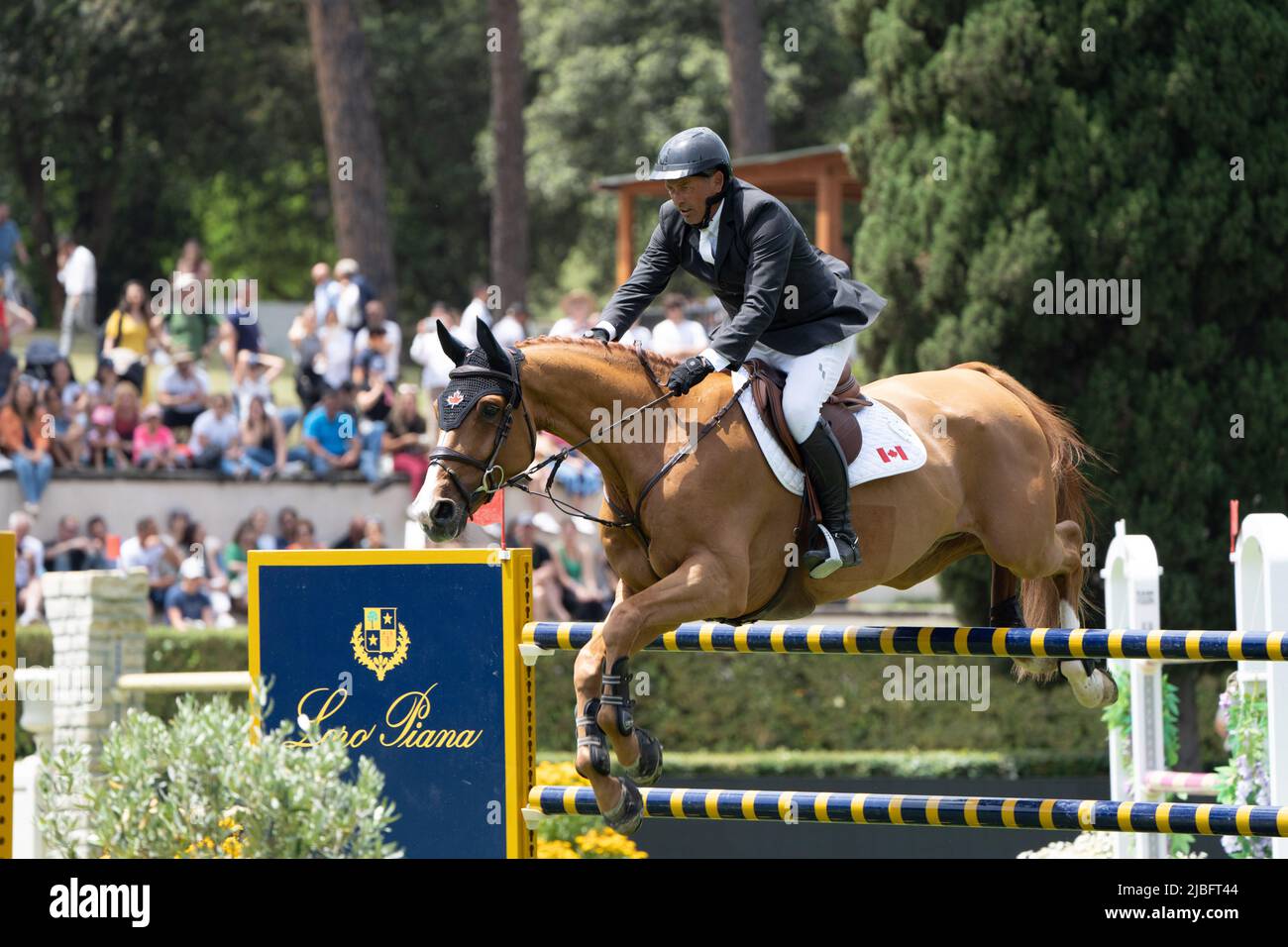 Rome, Italy,May 28, 2022 - A rider jumps over an obstacle riding a ...