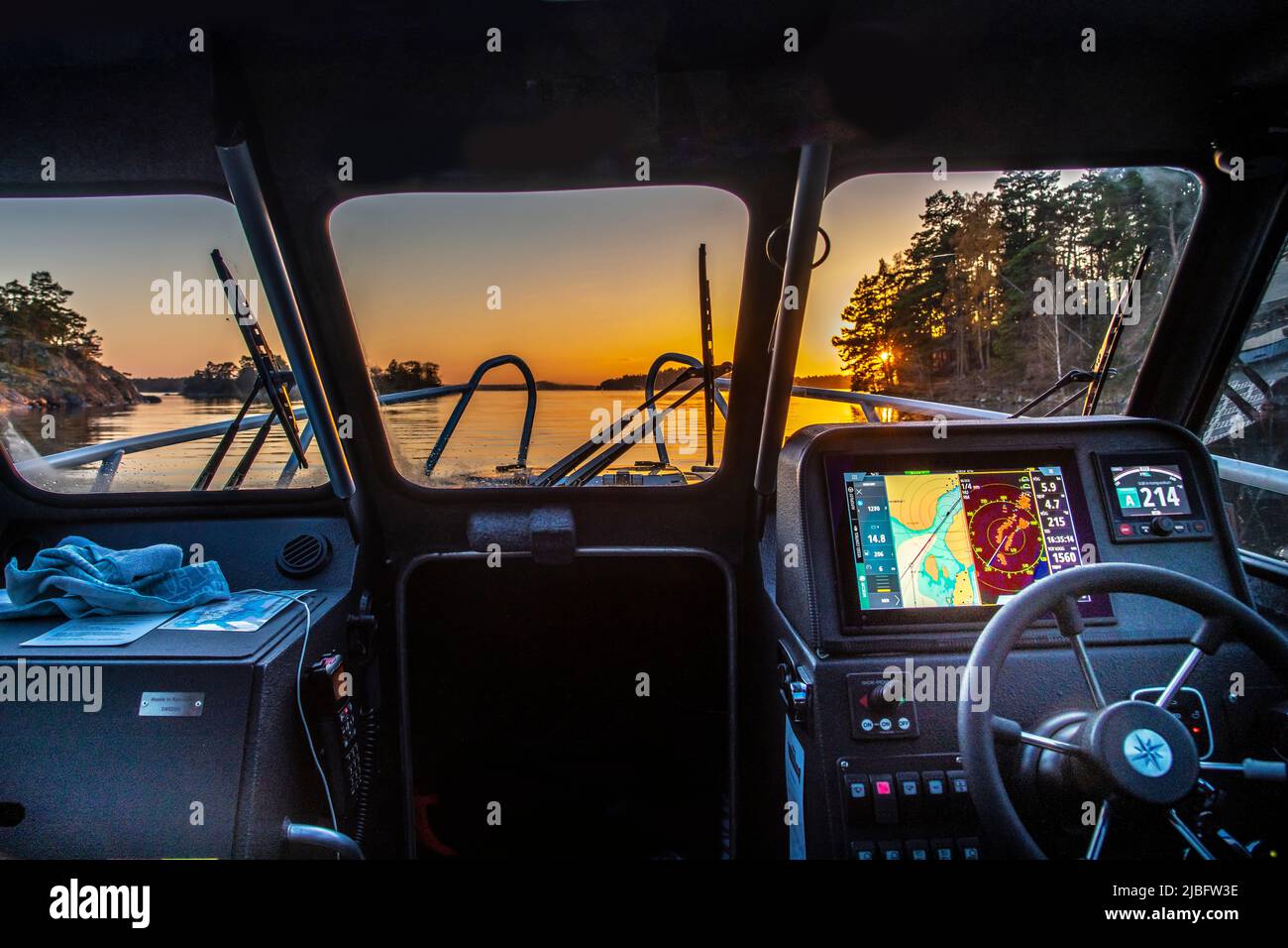 Cockpit of boat at sunset Stock Photo - Alamy