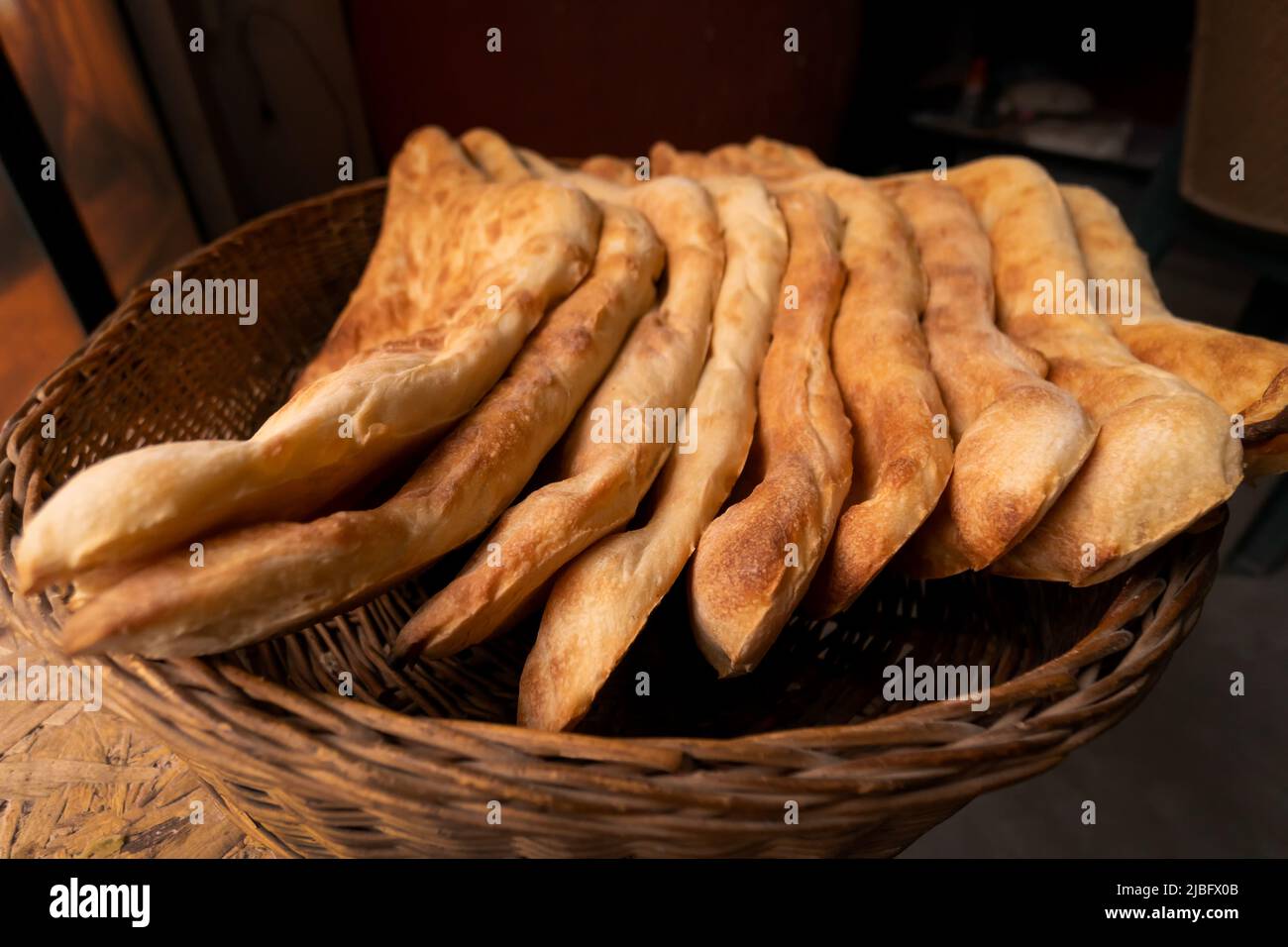 Stack of delicious traditional Georgian Shoti bread in a wicker basket ...