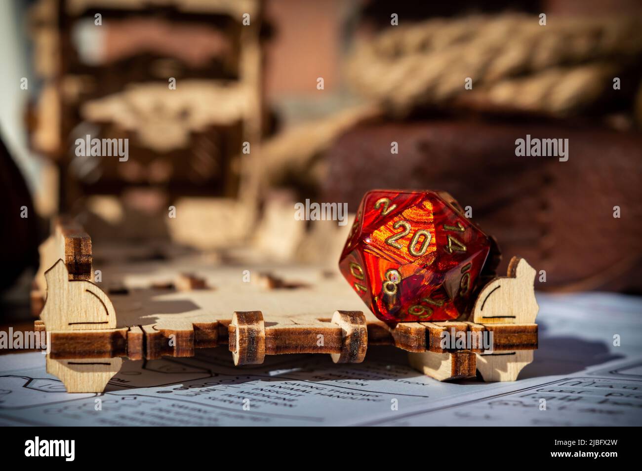 A red 20-sided role-playing gaming die on a dice tower tray Stock Photo ...