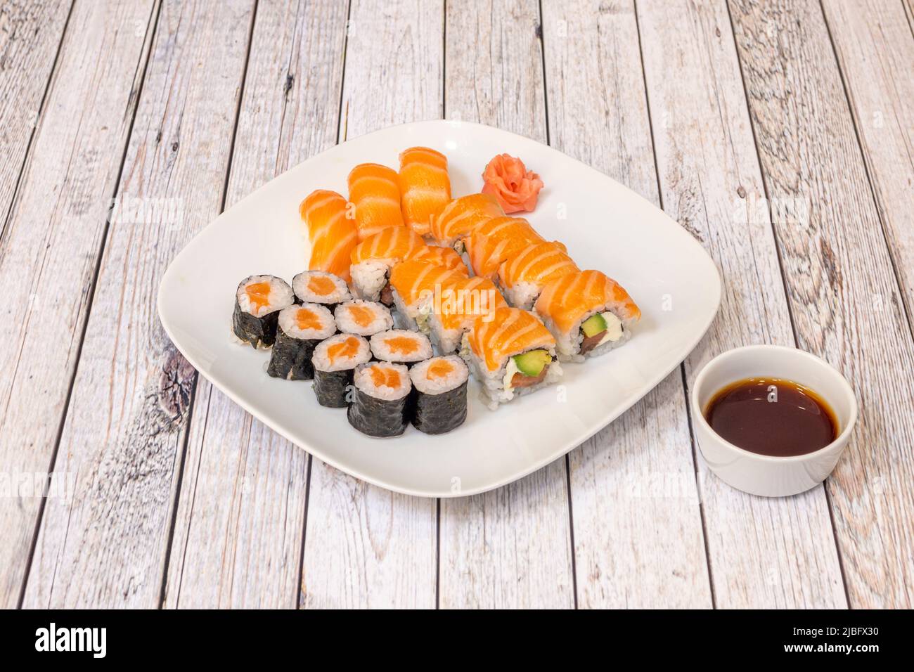 Mixed sushi tray with salmon uramaki with cream cheese, nori seaweed ...