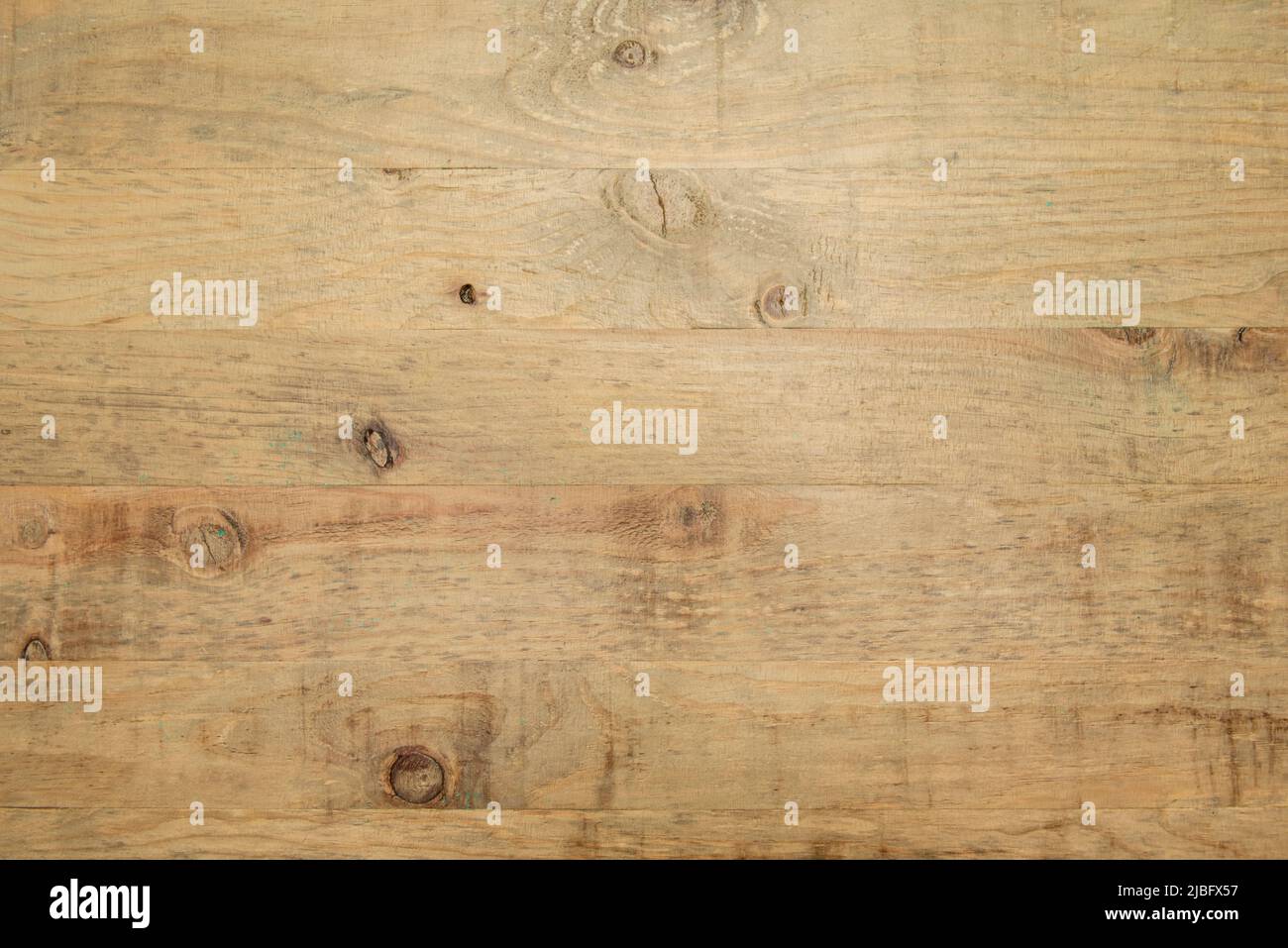 Wood board with clear varnish, saw cut marks and knots on all planks ...