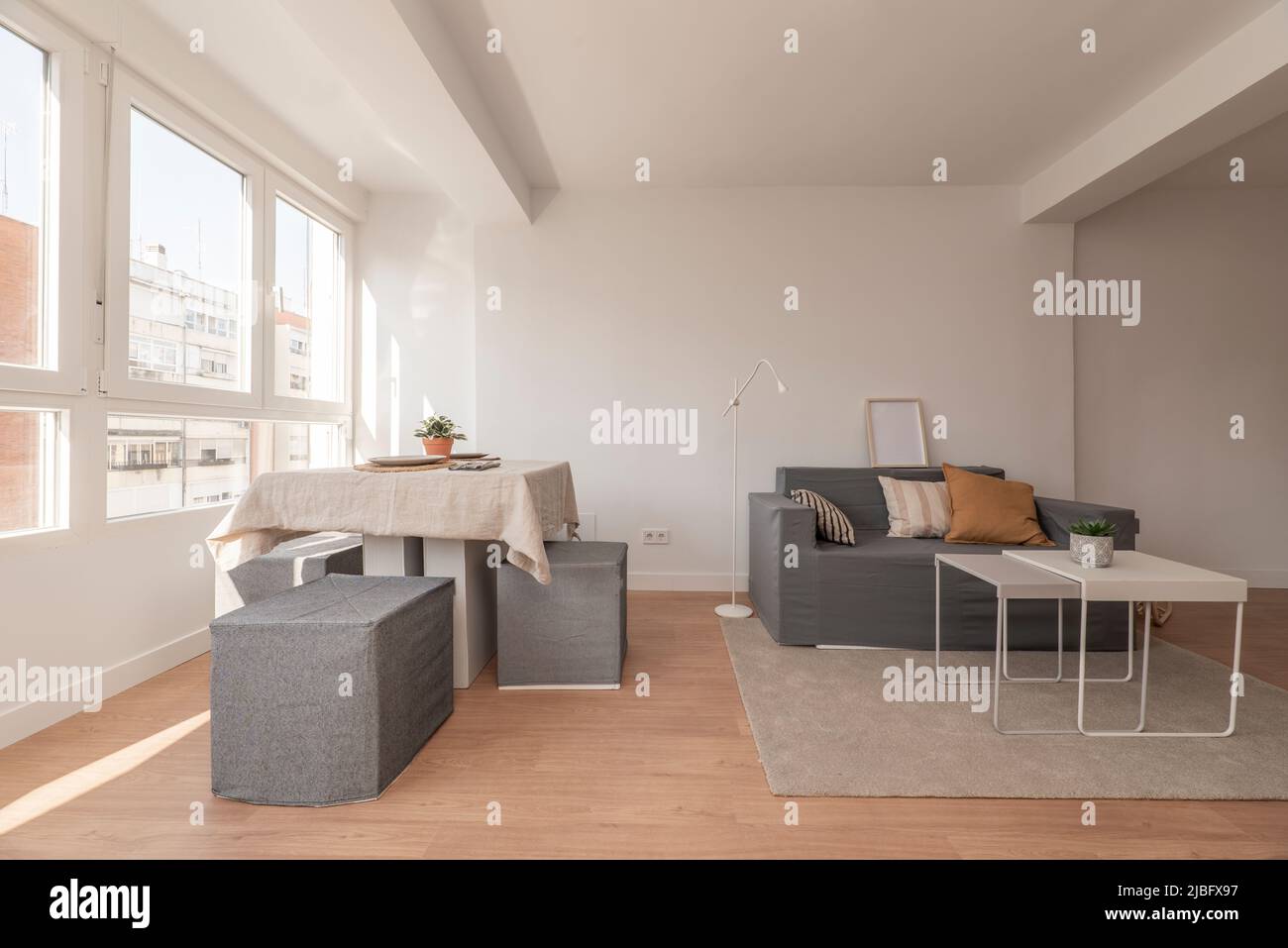 Living room with dining table next to the window with lots of light ...
