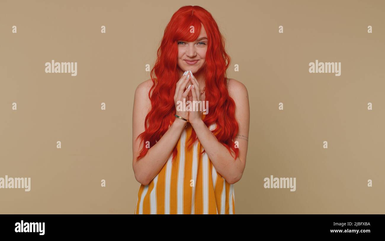 Sneaky cunning woman with tricky face gesticulating and scheming evil ...