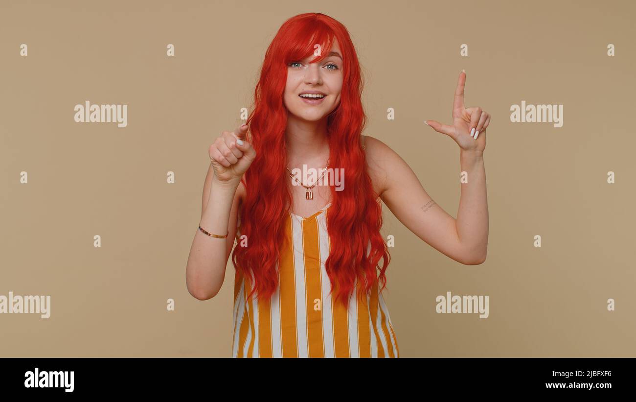 Woman showing loser gesture and pointing on you, blaming accusing for ...