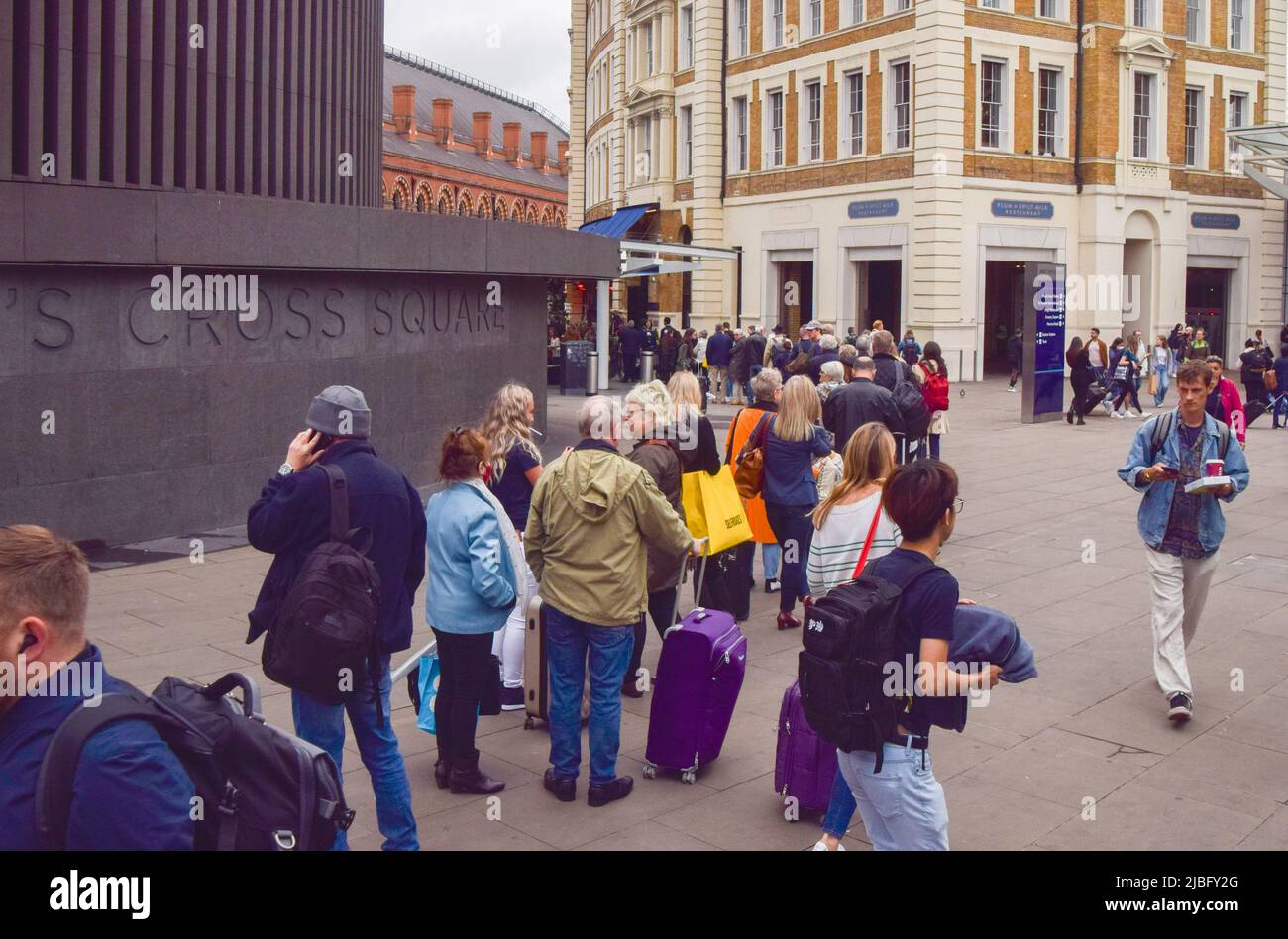 London, UK. 6th June 2022. A long queue forms at a taxi rank outside ...