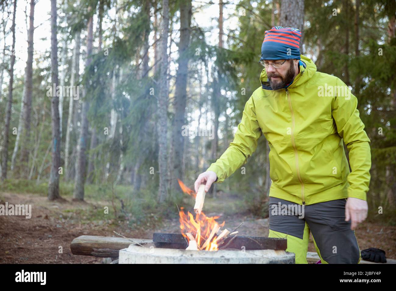 Man lighting fire outdoors hi-res stock photography and images - Alamy