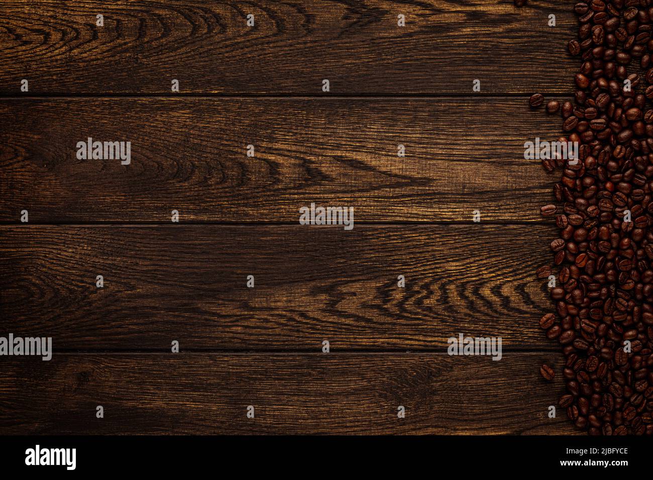 Coffee beans on table brown wood. Abstract wooden board background and ...