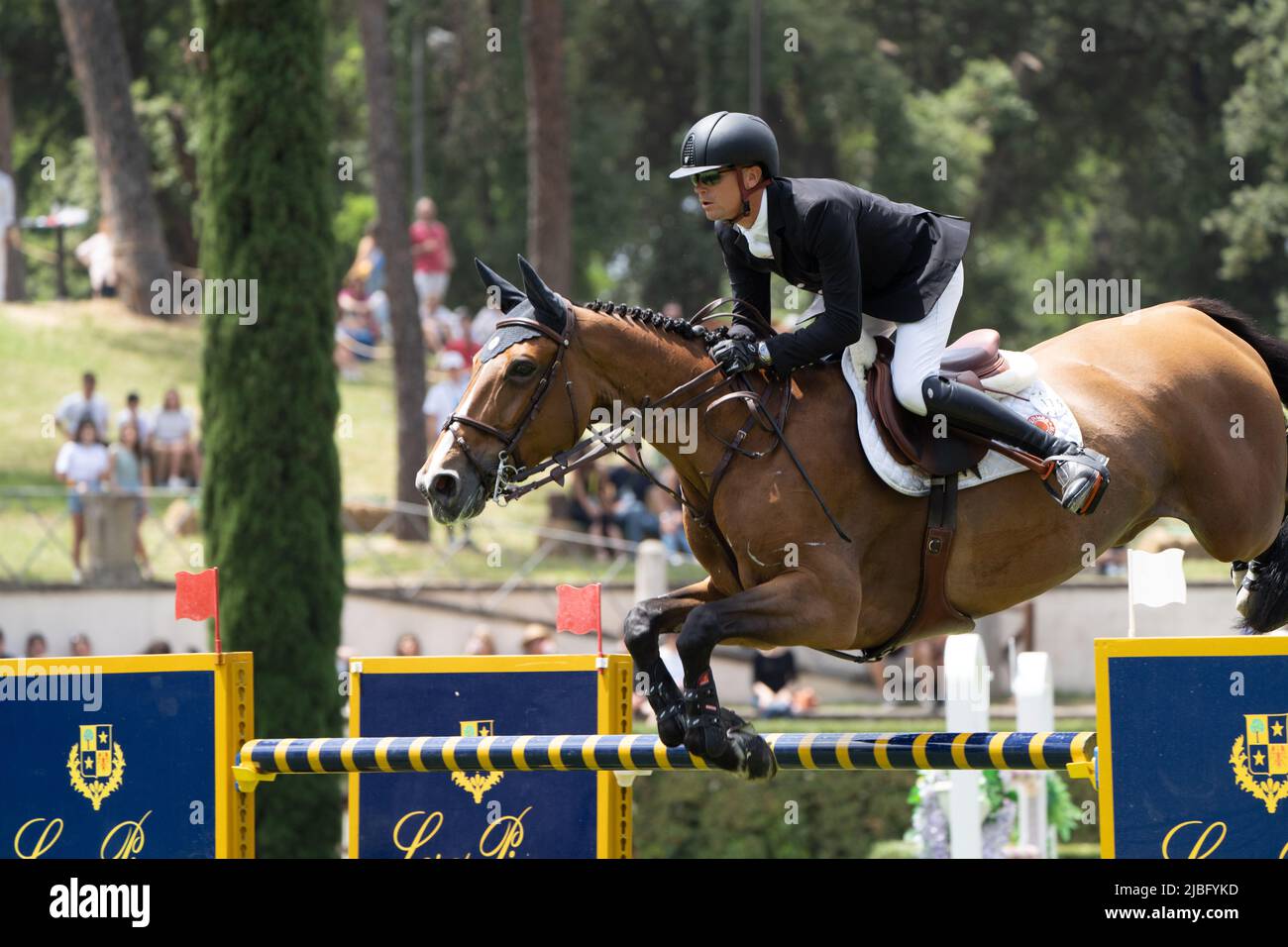 Rome, Italy,May 28, 2022 - A rider jumps over an obstacle riding a ...