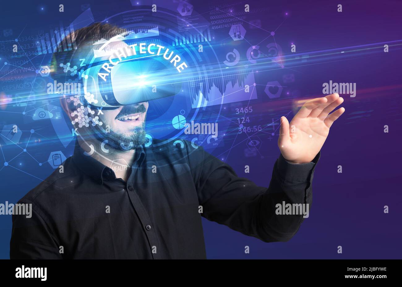 Businessman looking through VR glasses Stock Photo - Alamy