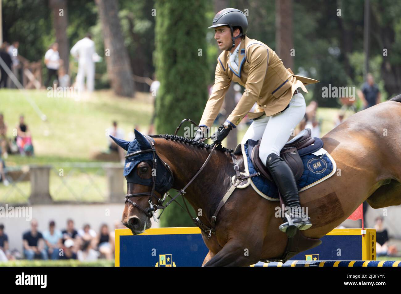 Rome, Italy,May 28, 2022 - A rider jumps over an obstacle riding a ...