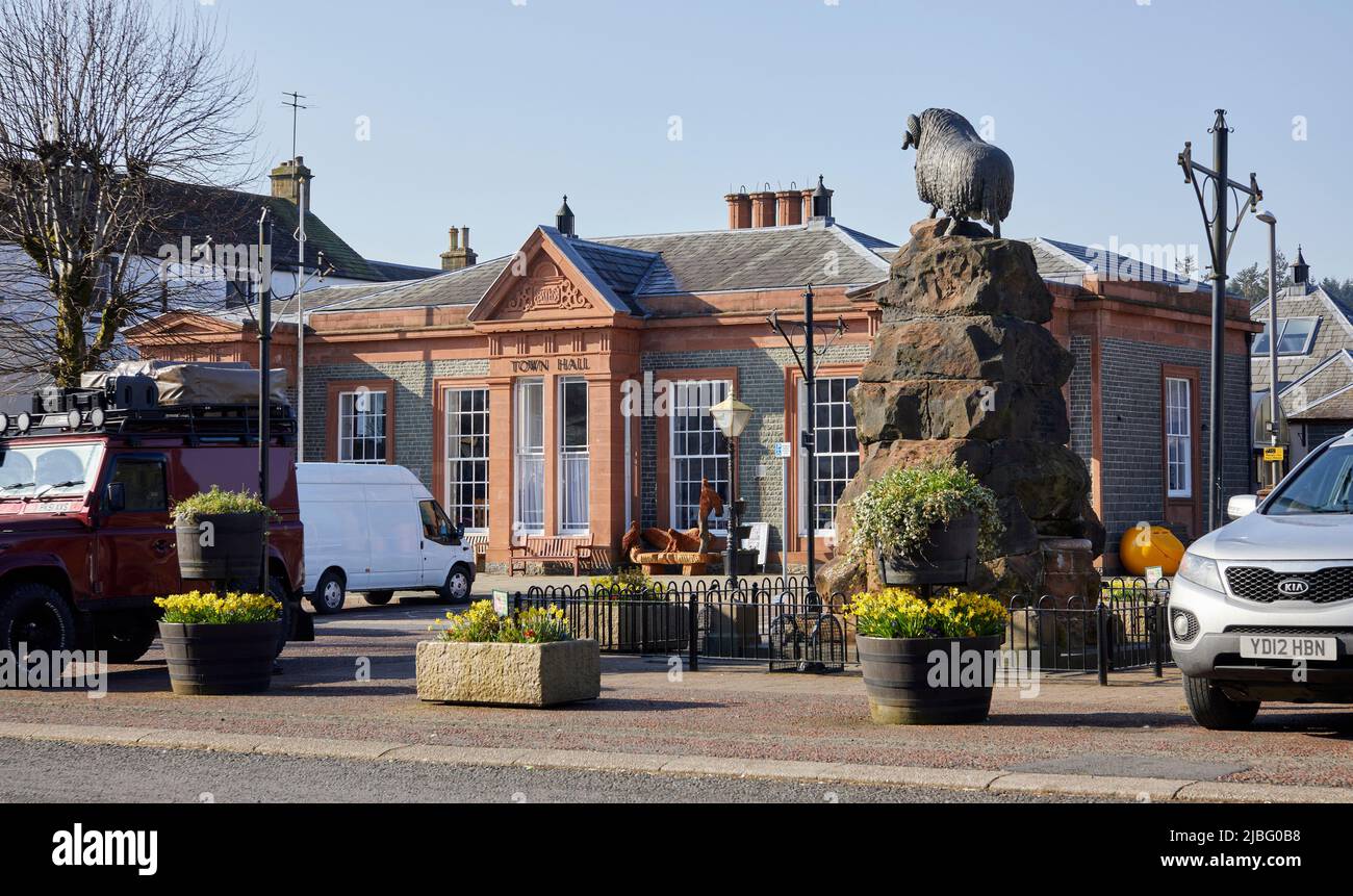 Early morning sunshine lights the Moffat Ram statue and the Town Hall ...