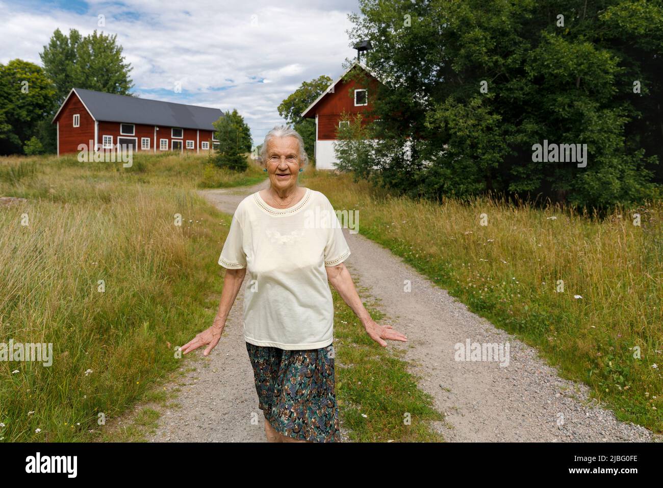 Woman walking on rural road hi-res stock photography and images - Alamy